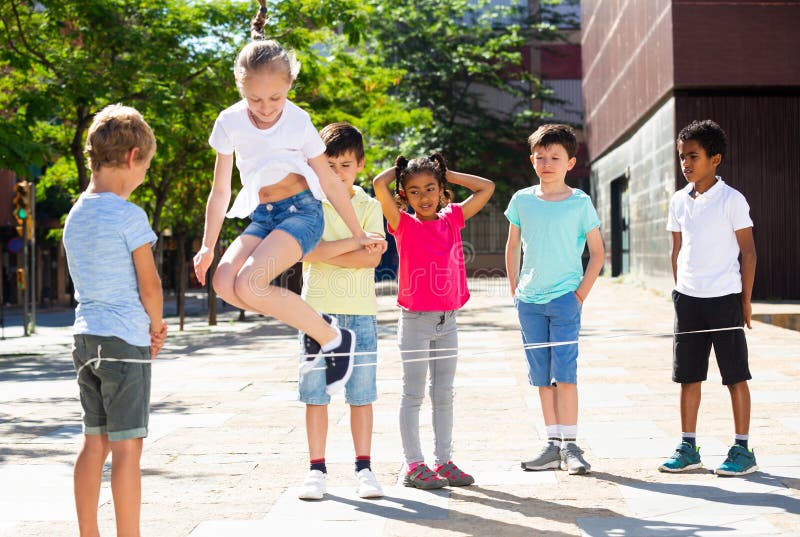 Happy Children Jumping Game by Rubber Band and Laughing Stock Photo ...