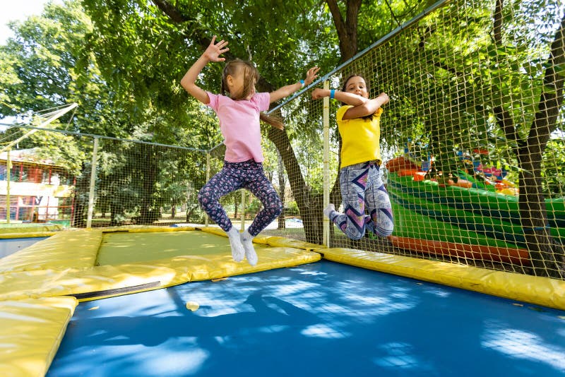 Happy Children Jumping on Trampoline Stock Photo - Image of childhood ...
