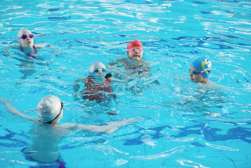 Happy Children Kids Group at Swimming Pool Class Learning To Swim Stock ...