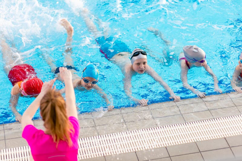 Happy Children Kids Group at Swimming Pool Class Learning To Swim Stock ...