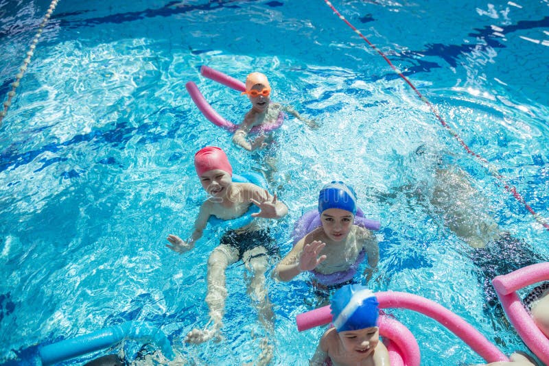 Happy Children Kids Group at Swimming Pool Class Learning To Swim Stock ...