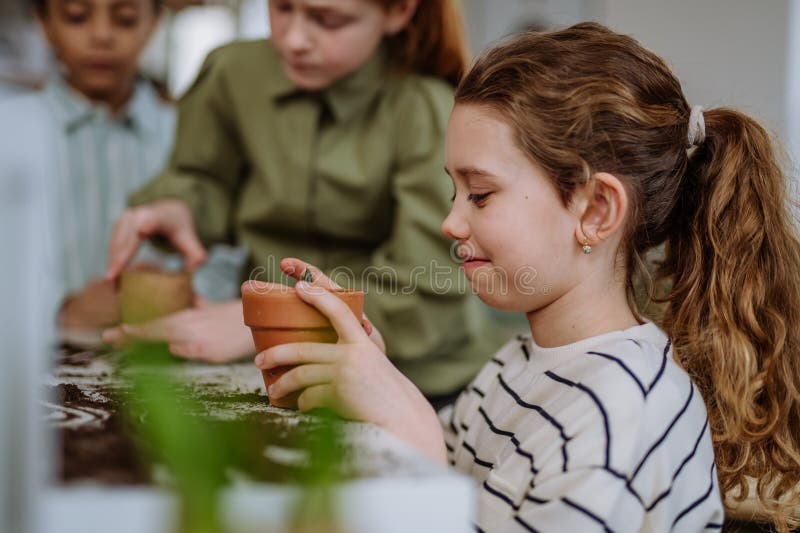 Happy Children Learning How To Take Care about Plants. Stock Image ...