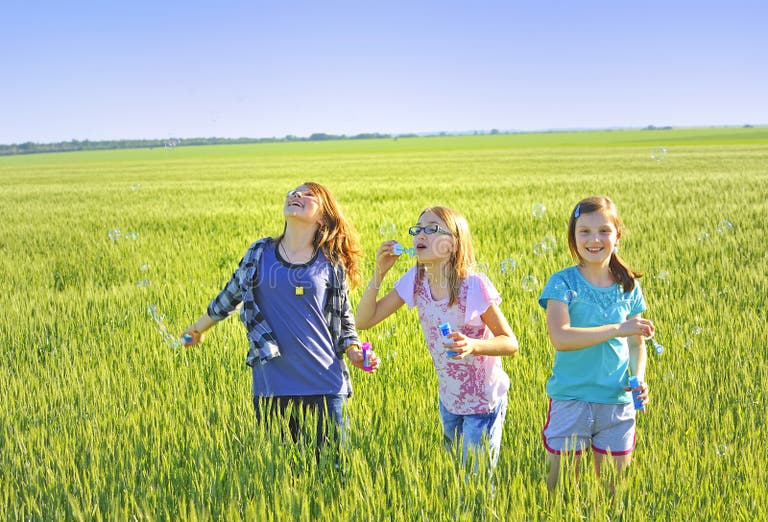 Happy Children Making Bubbles Stock Image - Image of grass, restful ...