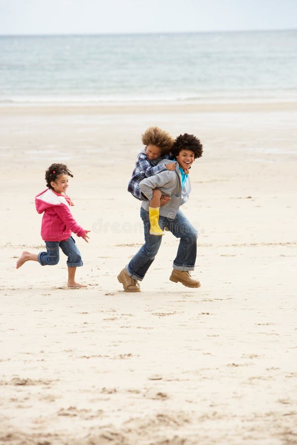 Happy Children Playing Piggyback on Beach Stock Image - Image of ...
