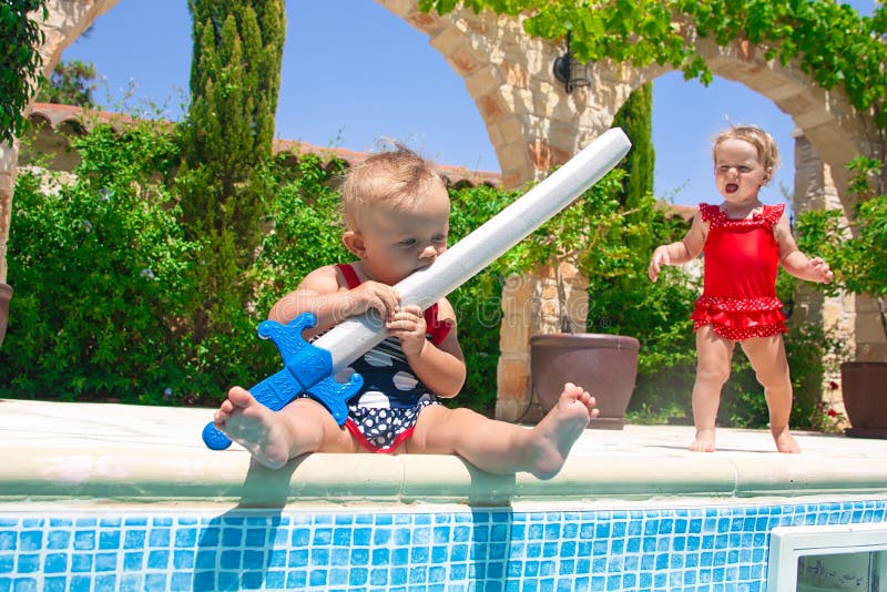 Happy Children Playing in the Pool Stock Photo - Image of aqua, males ...