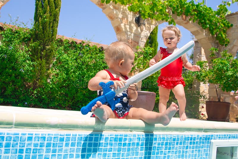 Happy Children Playing in the Pool Stock Photo - Image of blue, friends ...