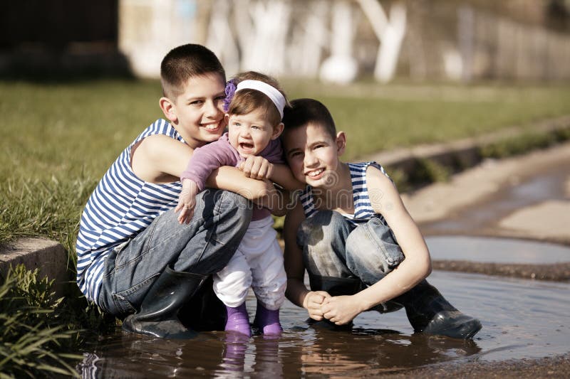 Happy Children Playing in the Puddle Stock Photo - Image of little ...