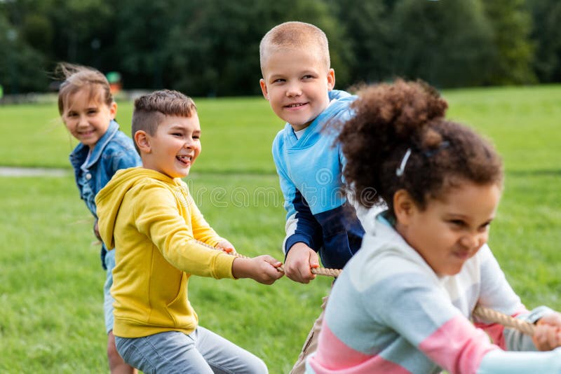 Happy Children Jumping through Hula Hoop at Park Stock Image - Image of ...