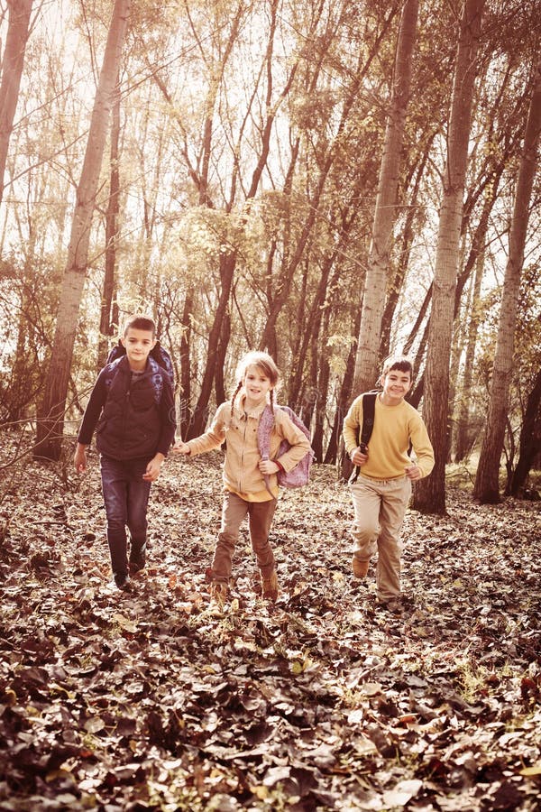 Small Group of Children Returning from School. Stock Image - Image of ...