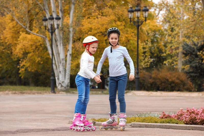 Happy Children Roller Skating Stock Photo - Image of fall, game: 131950024