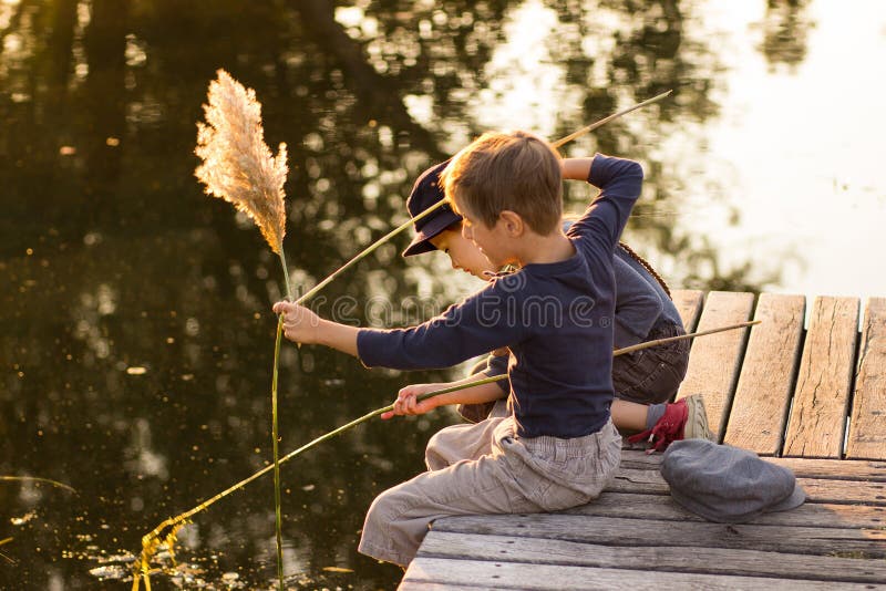 Happy Children Sitting with Sticks in Hands Stock Image - Image of ...
