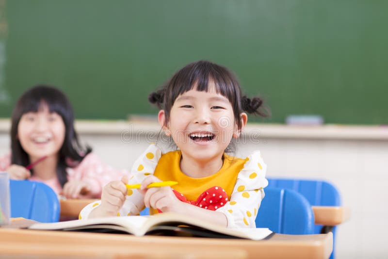Happy Children Studying in a Classroom Stock Photo - Image of ...