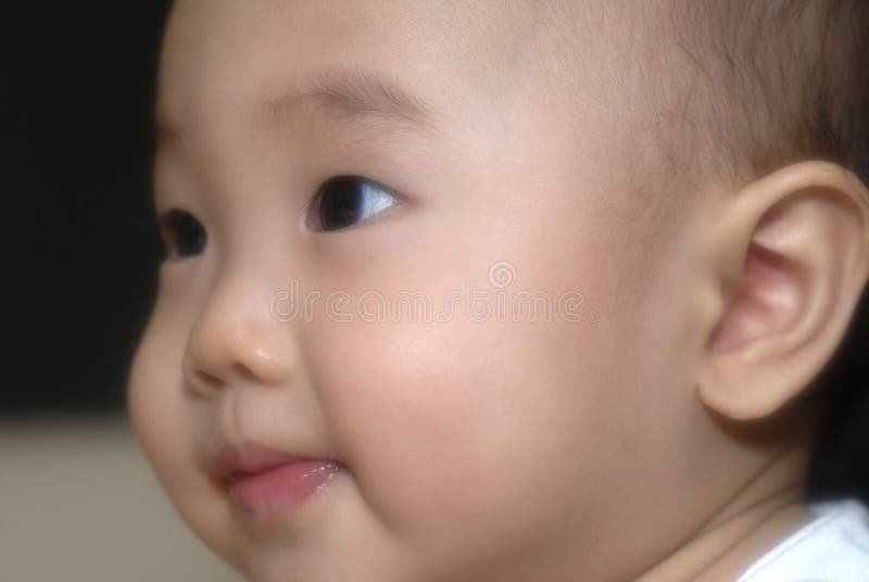 Chinese baby face smirking stock photo. Image of looking - 19376676