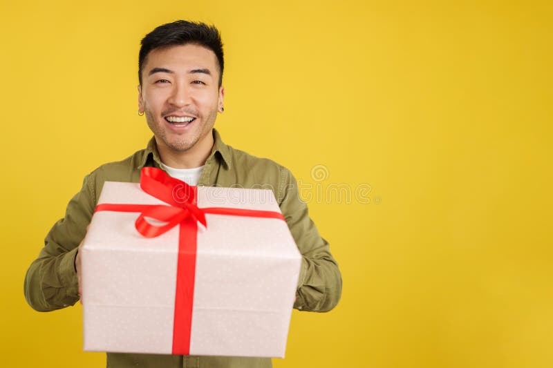 Happy Chinese Man Looking at the Camera Giving a Present Stock Photo ...