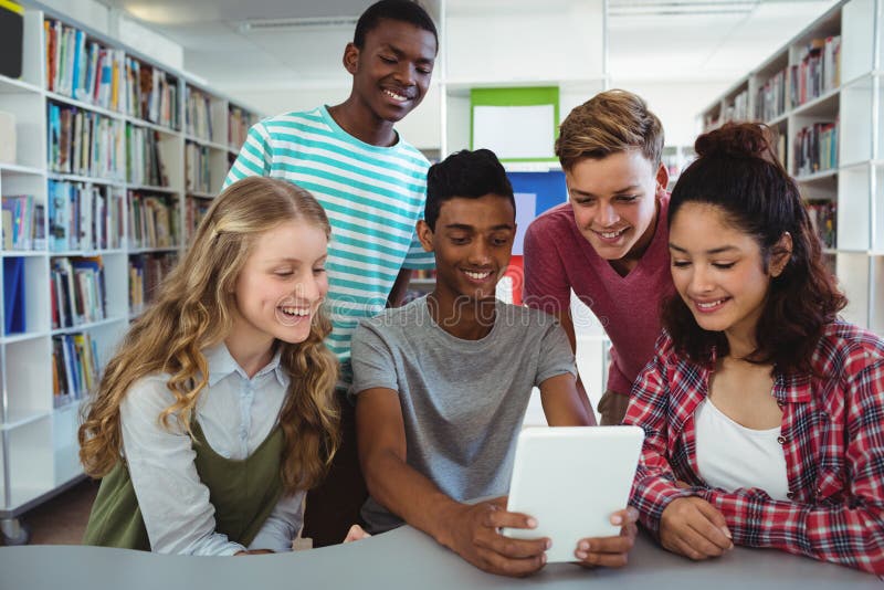 Happy Classmates Using Digital Tablet in Library Stock Image - Image of ...