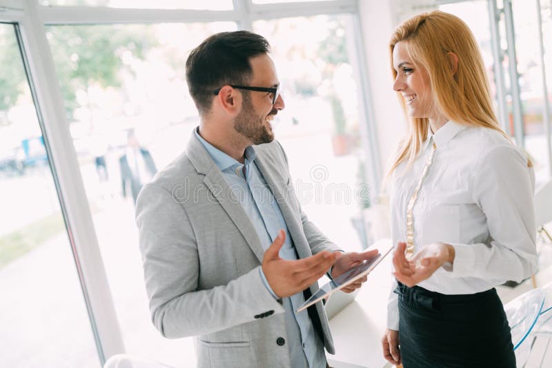 Happy Colleagues Casual Chat at the Office Stock Image - Image of ...