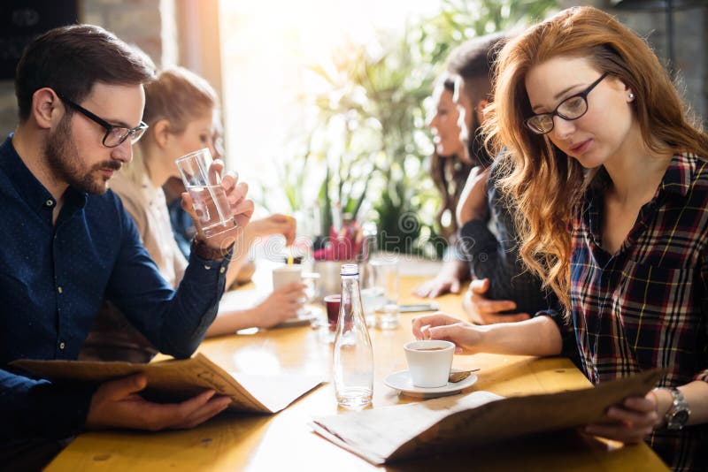 Happy Colleagues from Work Socializing in Restaurant Stock Photo ...