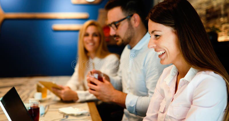 Happy Colleagues from Work Socializing in Restaurant Stock Photo ...