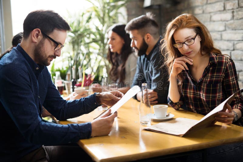 Happy Colleagues from Work Socializing in Restaurant Stock Photo ...