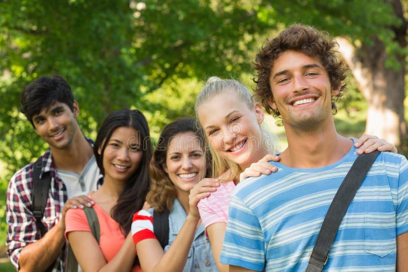 College Friends Gesturing Thumbs Up in Campus Stock Image - Image of ...