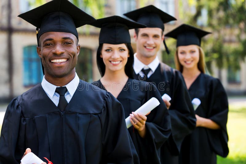 Students Showing Diplomas On Graduation Day In College Stock Photo ...