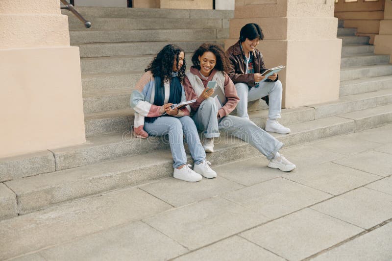 Group of Young Happy Students Watching Something at Mobile Phone ...