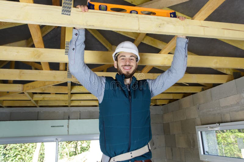 Happy Construction Worker Using Bubble Level Stock Image - Image of ...
