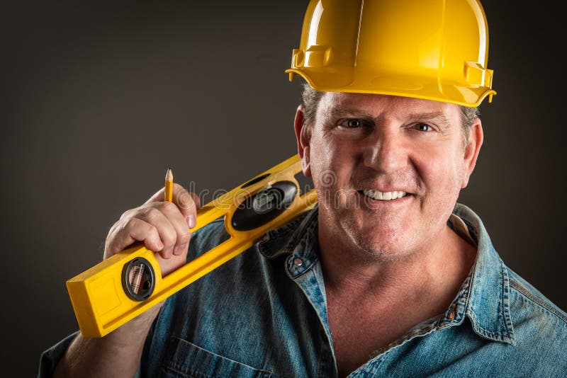 Happy Contractor in Hard Hat Holding Level and Pencil Stock Image ...