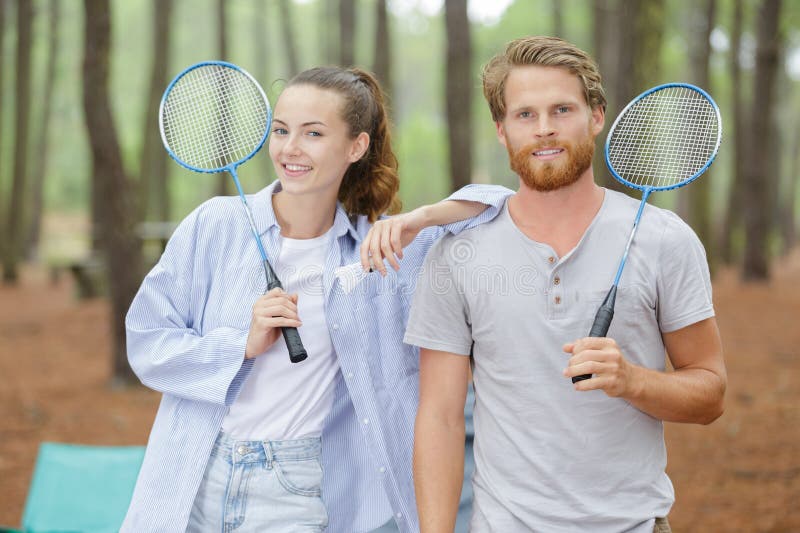 Happy Couple with Badminton Racquets Outdoors Stock Image - Image of ...