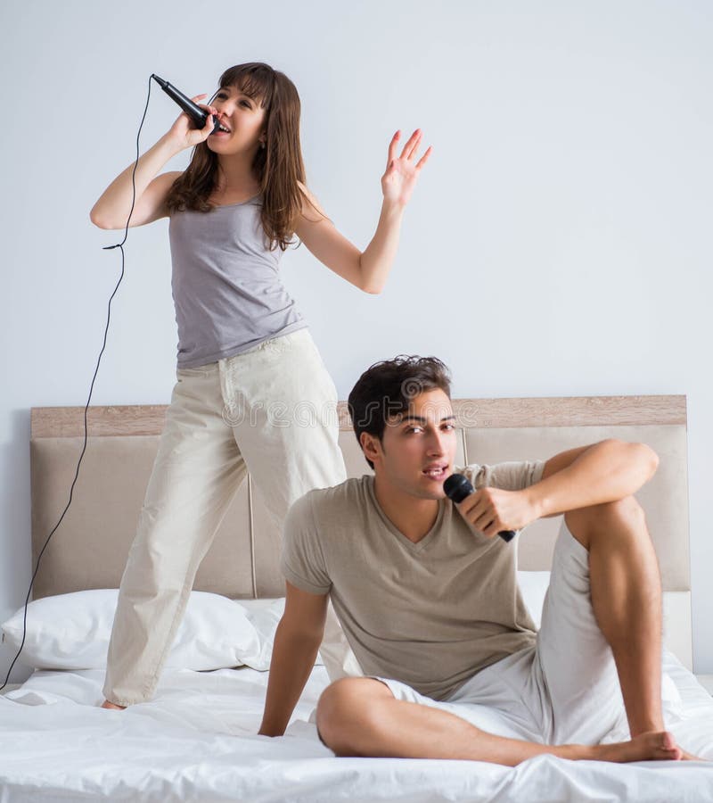 Happy couple in the bed stock photo. Image of husband - 179082074