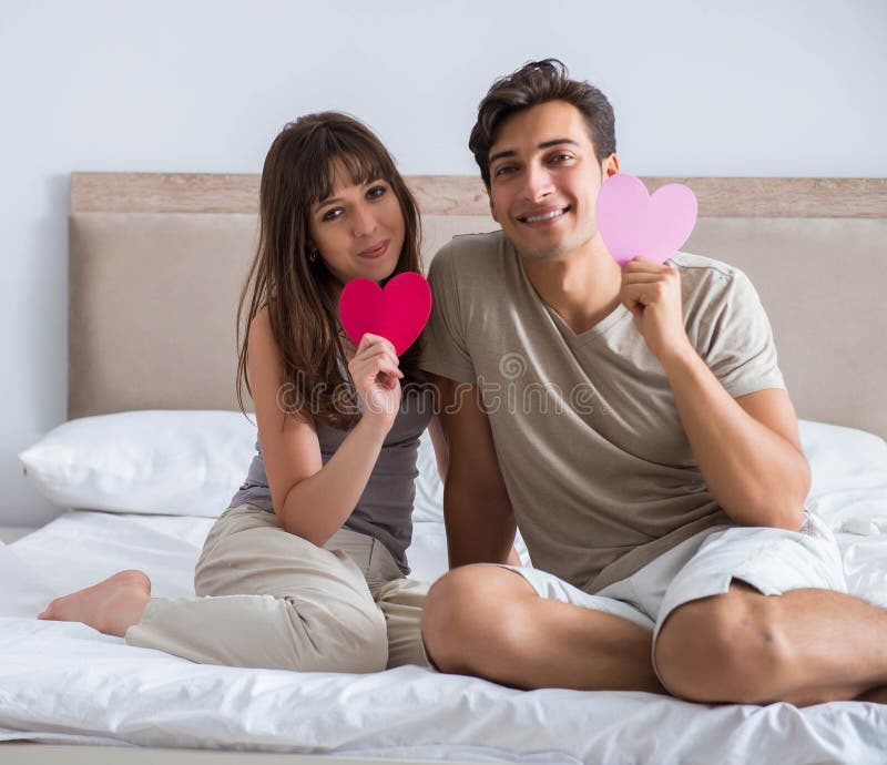 Happy couple in the bed stock photo. Image of girl, family - 182017062