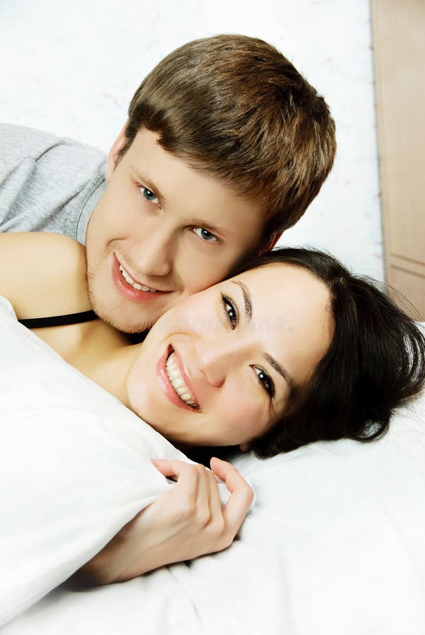 Happy couple in bed stock photo. Image of people, handsome - 7755972