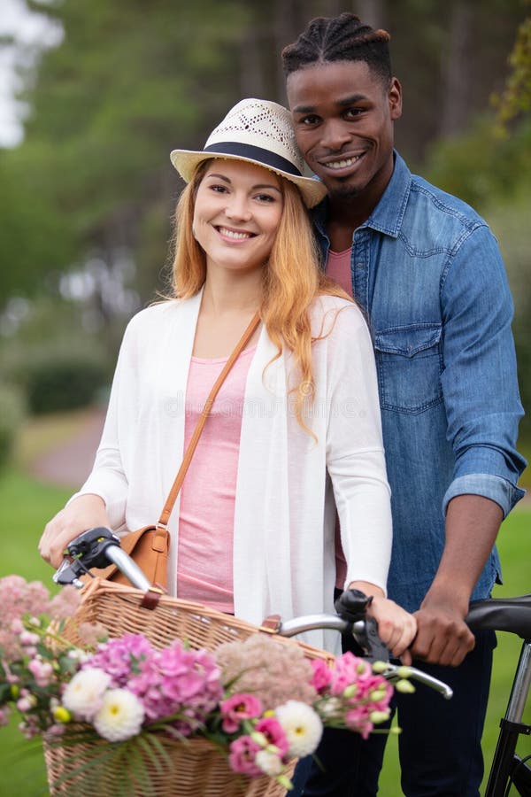 Happy Couple on Bike Ride Outdoors Stock Photo - Image of bicycle ...
