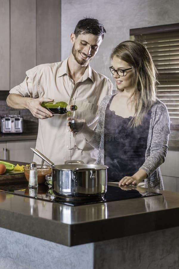 Happy Couple Bonding Together while Cooking a Meal in the Kitchen ...