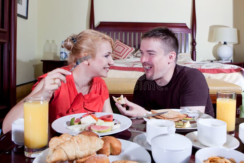 Happy couple at breakfast stock photo. Image of pretty - 24295028