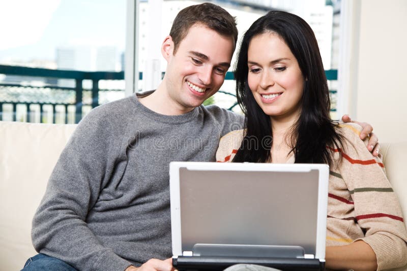 Happy Couple Browsing Internet at Home Stock Photo - Image of beautiful ...