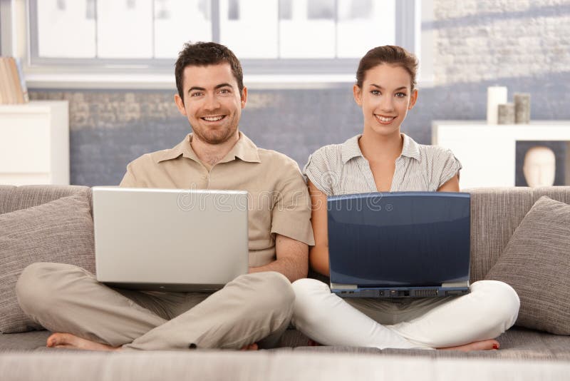 Happy Couple Browsing Internet at Home Smiling Stock Image - Image of ...