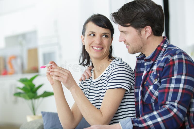 Happy Couple Checking Pregnancy Test with Positive Result Stock Photo ...