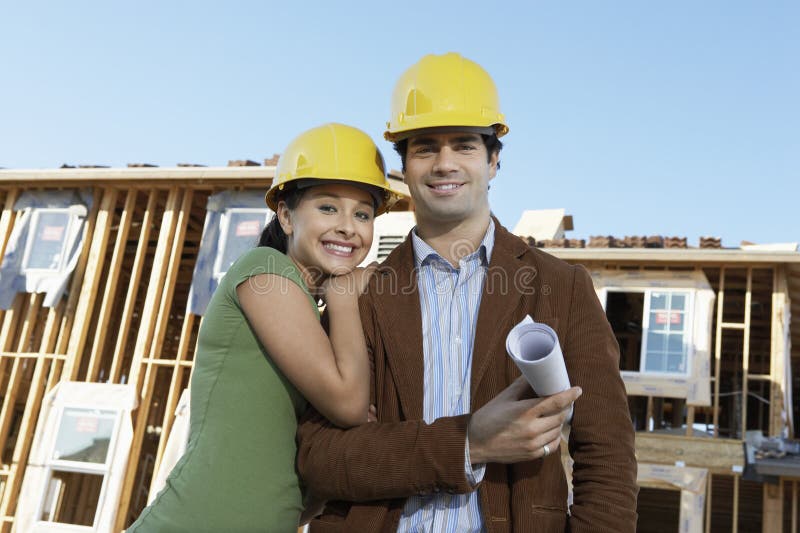 Happy Couple at Construction Site Stock Image - Image of safety, people ...
