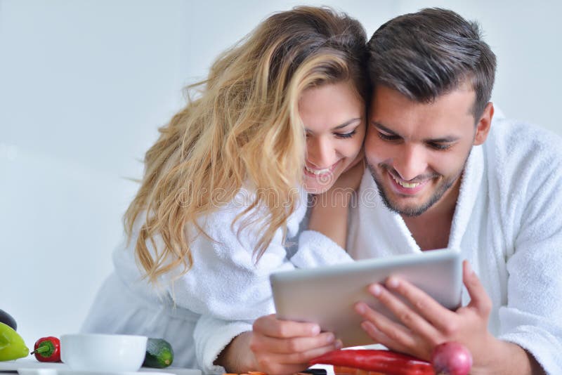 Happy Couple Cooking Breakfast Together in the Kitchen Stock Photo ...
