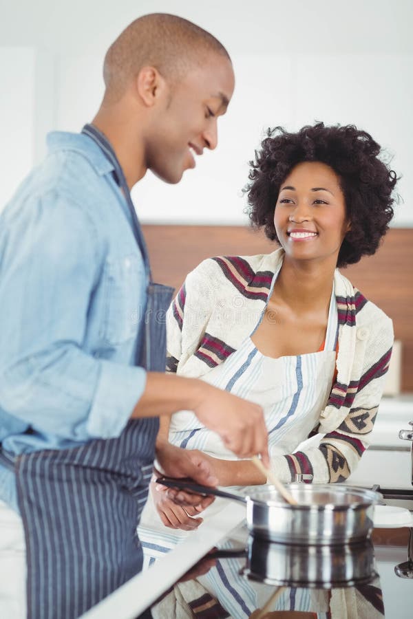 Happy Couple Cooking Together Stock Photo - Image of domestic, happy ...