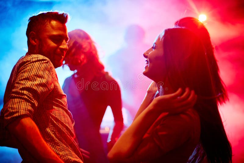 Happy couple at disco stock image. Image of happy, group - 59444007