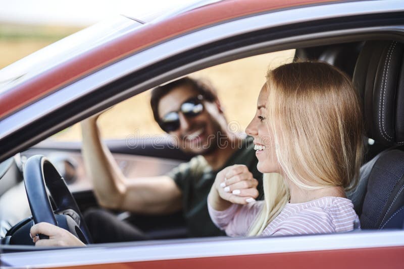 Couple driving in the car stock image. Image of long - 213007735