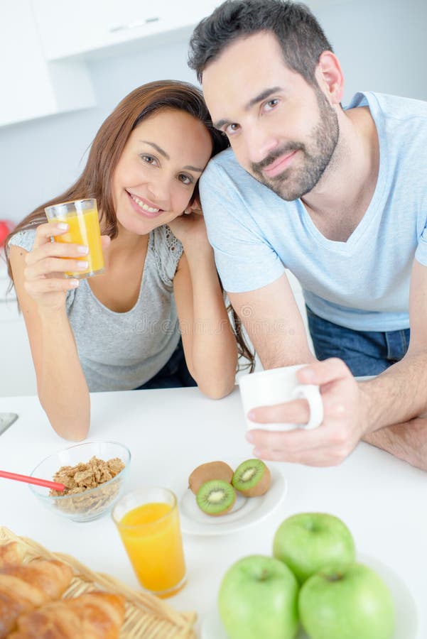Happy Couple Eats Breakfast Together Stock Image - Image of hold ...