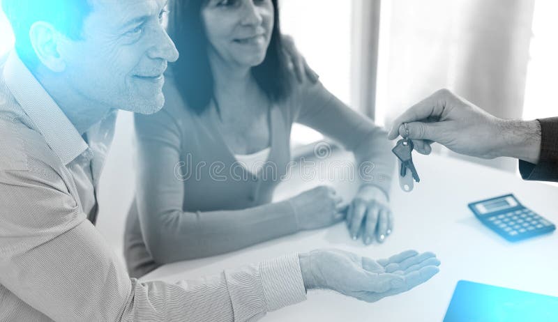 Happy Couple Getting House Keys from Realtor;light Effect Stock Image ...