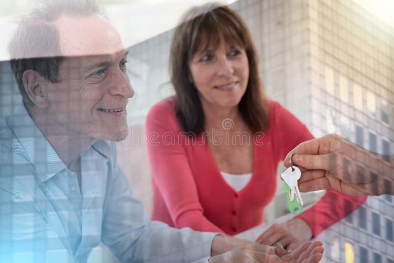 Happy Couple Getting House Keys from Realtor; Multiple Exposure Stock ...