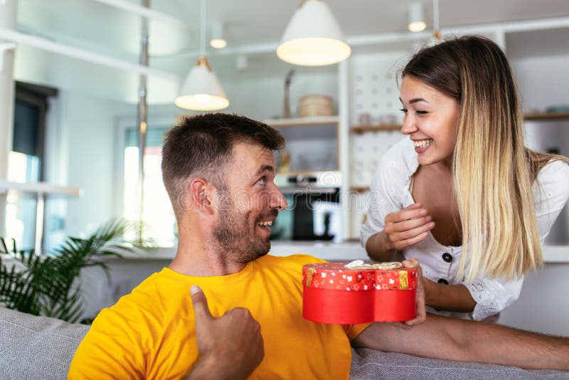 Couple with Gift Box Hugging at Home Stock Image - Image of couple ...
