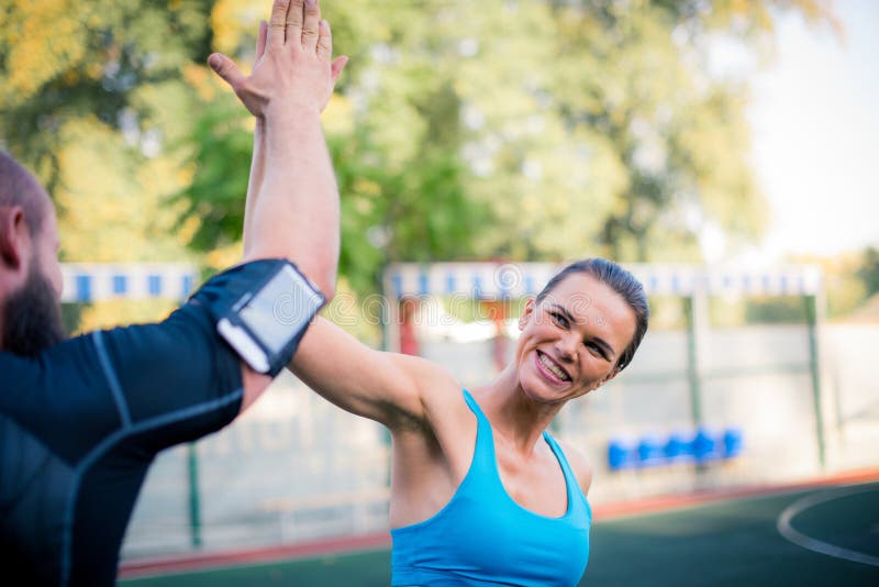 Happy Couple Giving High Five Stock Image - Image of agreement, smiling ...