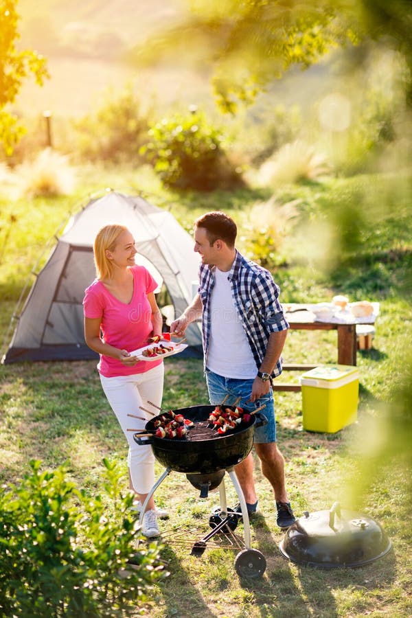 Happy couple grilling meat stock image. Image of lifestyle - 87881851