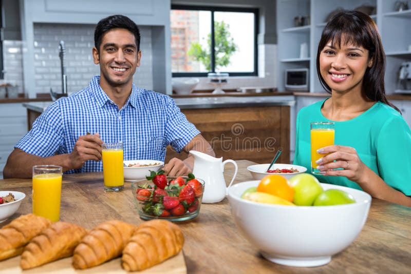 Happy Couple Having Breakfast Stock Photo - Image of homey, enjoyment ...